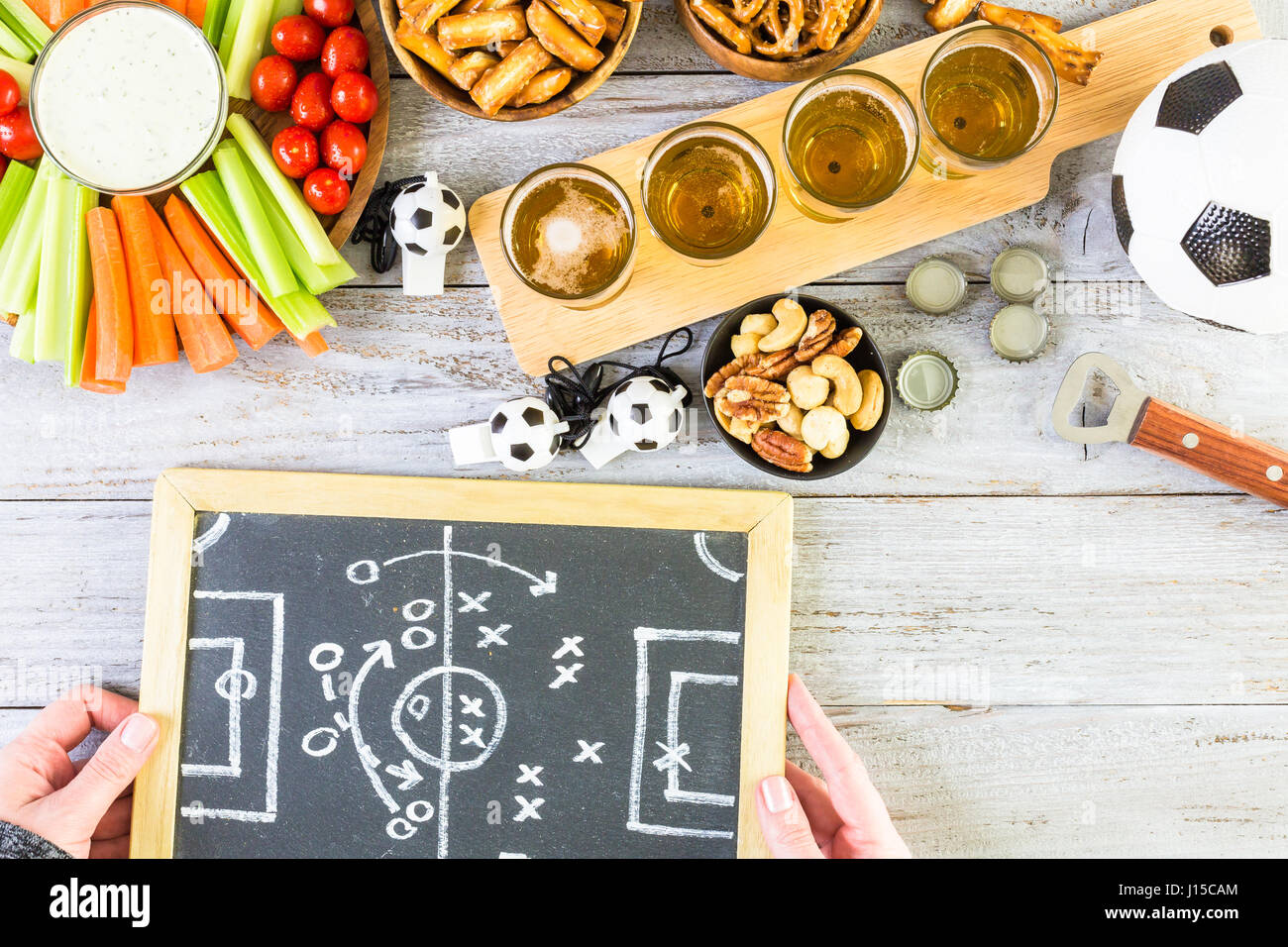 Draft beer and salty snacks on the table for soccer party Stock Photo ...