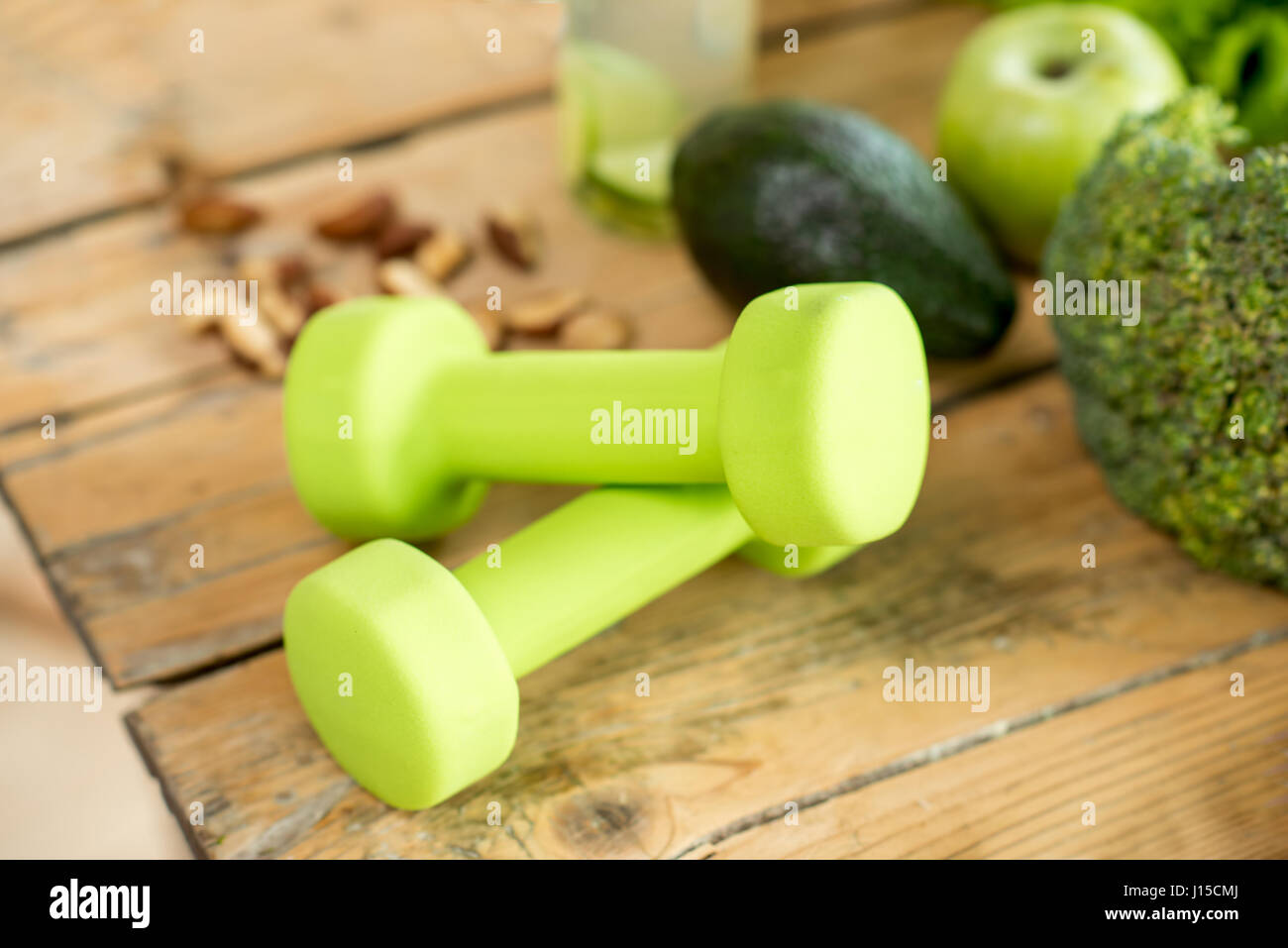 dumbbells with healthy food Stock Photo - Alamy