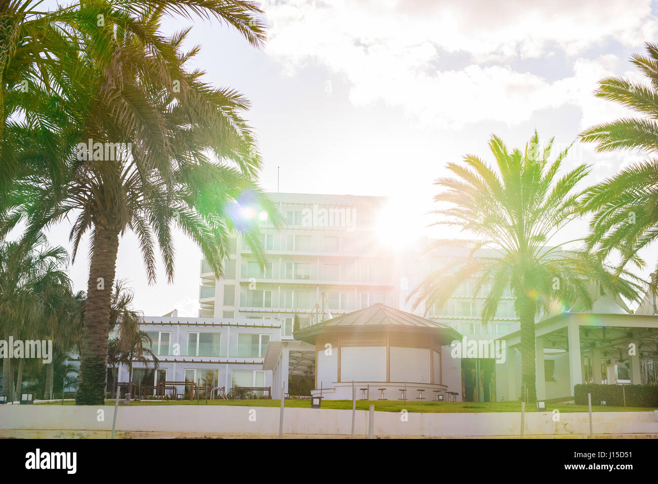 Front view of a hotel in evening sun Stock Photo - Alamy