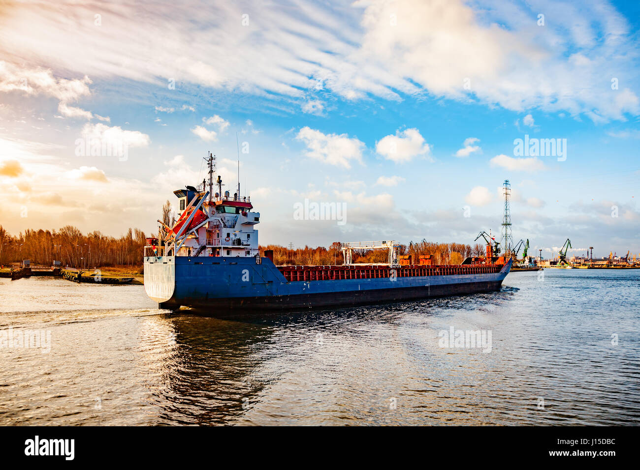 A cargo ship entering port of Gdansk, Poland Stock Photo - Alamy
