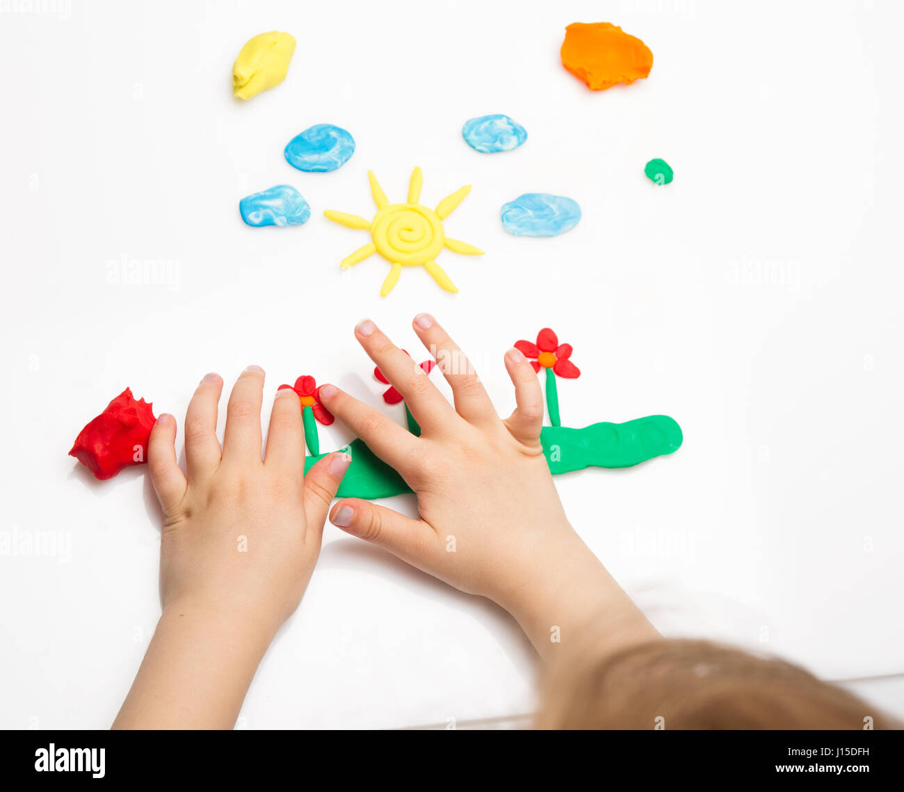Child hands playing with colorful clay Stock Photo - Alamy