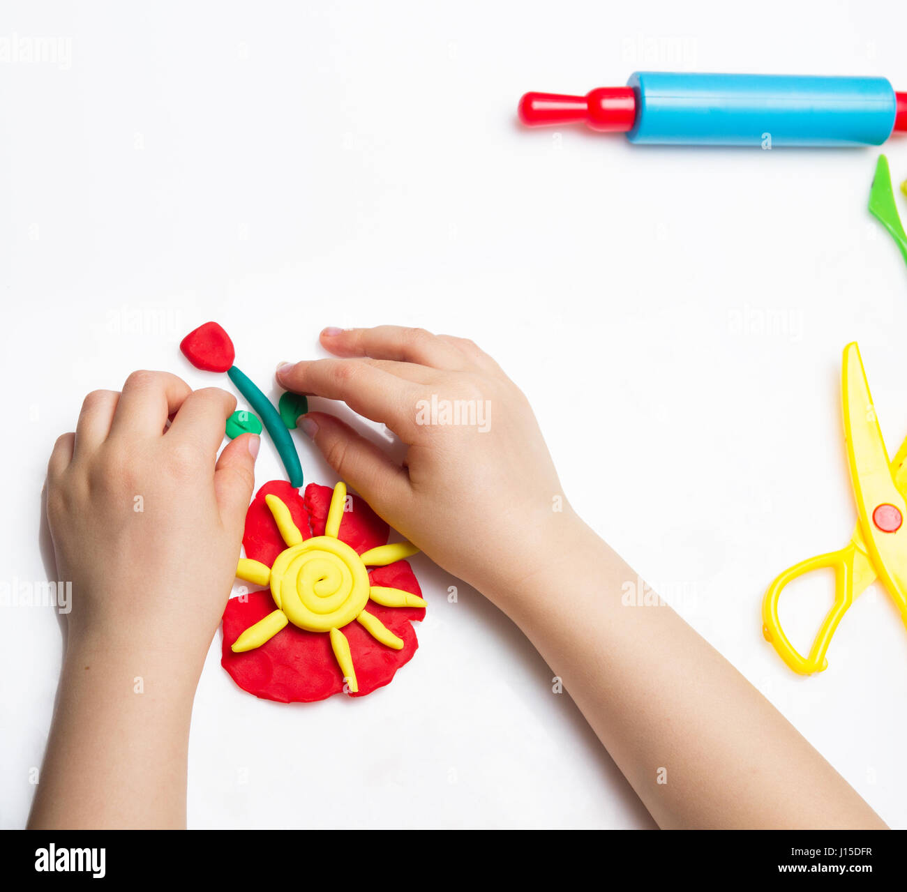 Child hands playing with colorful clay Stock Photo - Alamy