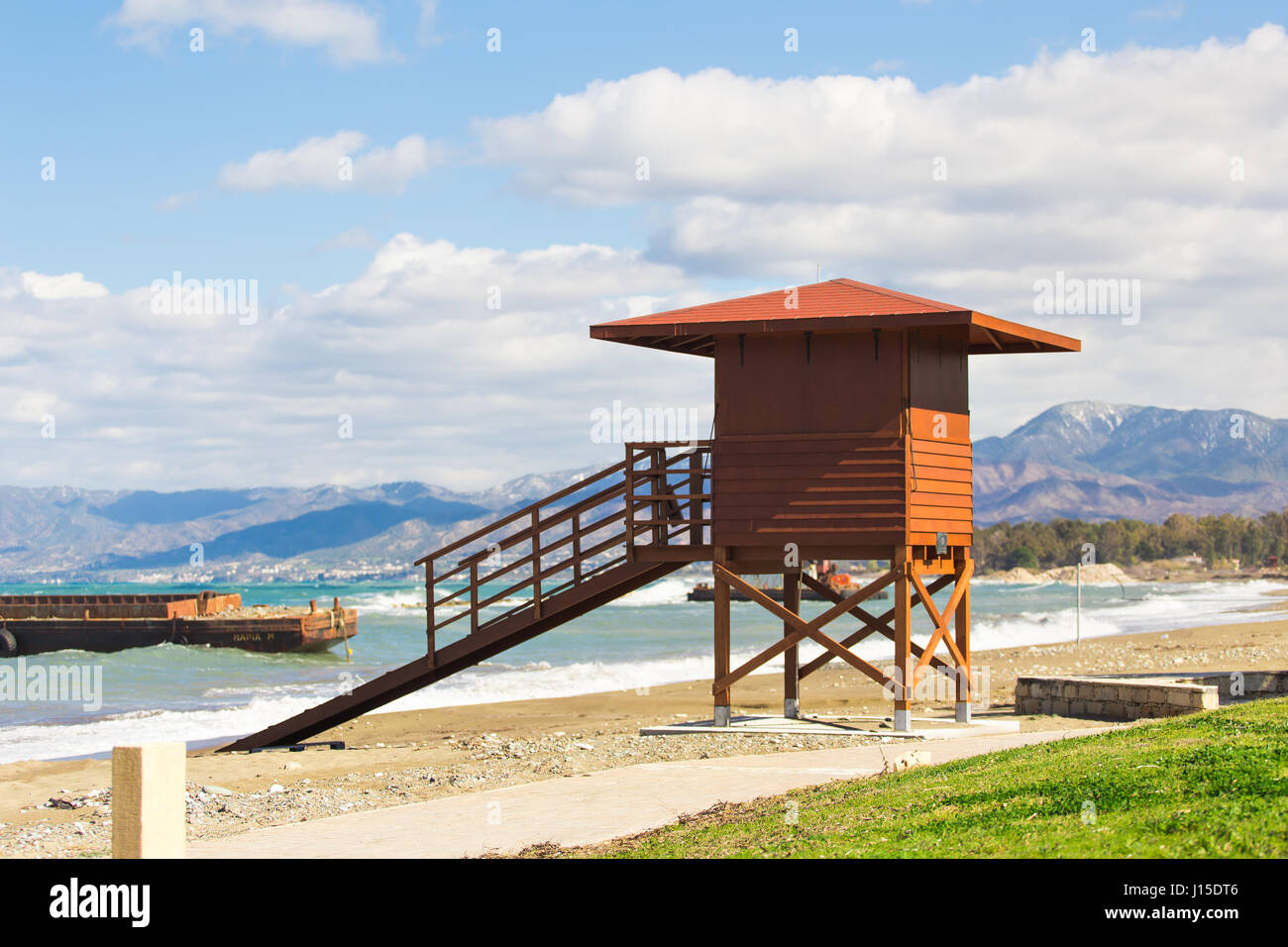 Red wooden lifeguard hut on an empty morning beach Stock Photo - Alamy