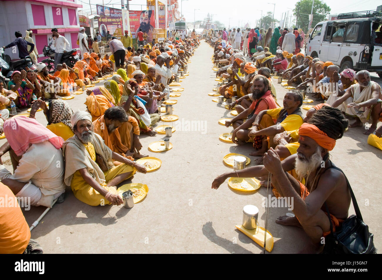 Pilgrims eating holy prasad, kumbh mela, ujjain, madhya pradesh, india ...