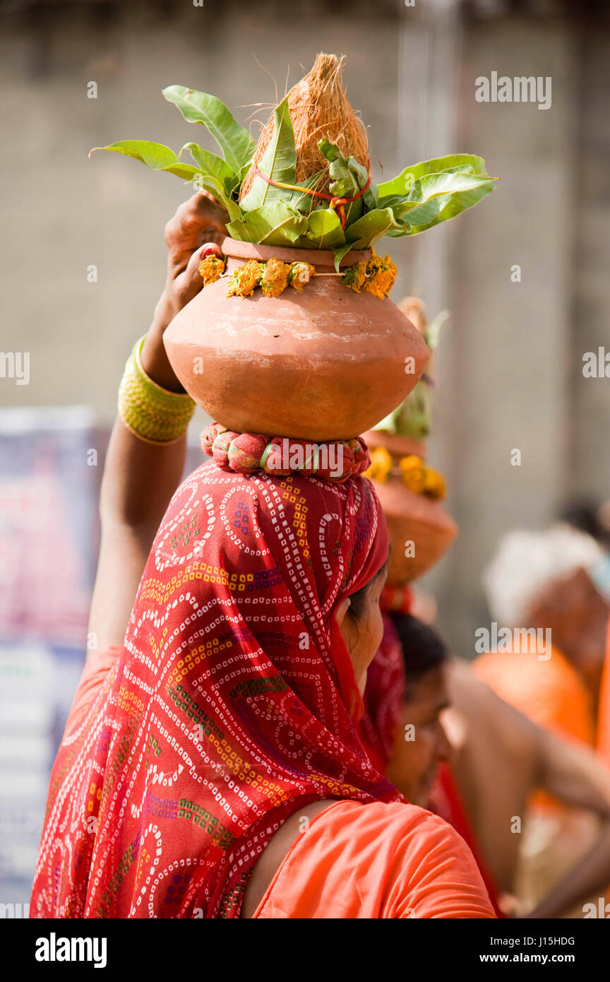 Woman holding ritual pot, kumbh mela, ujjain, madhya pradesh, india ...