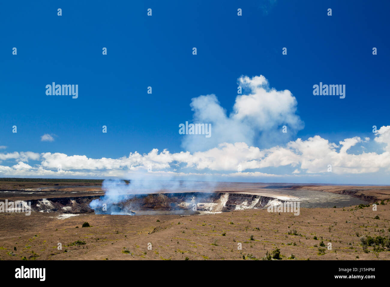 Volcanic steam rising from the crater of the active volcano Kilauea in ...