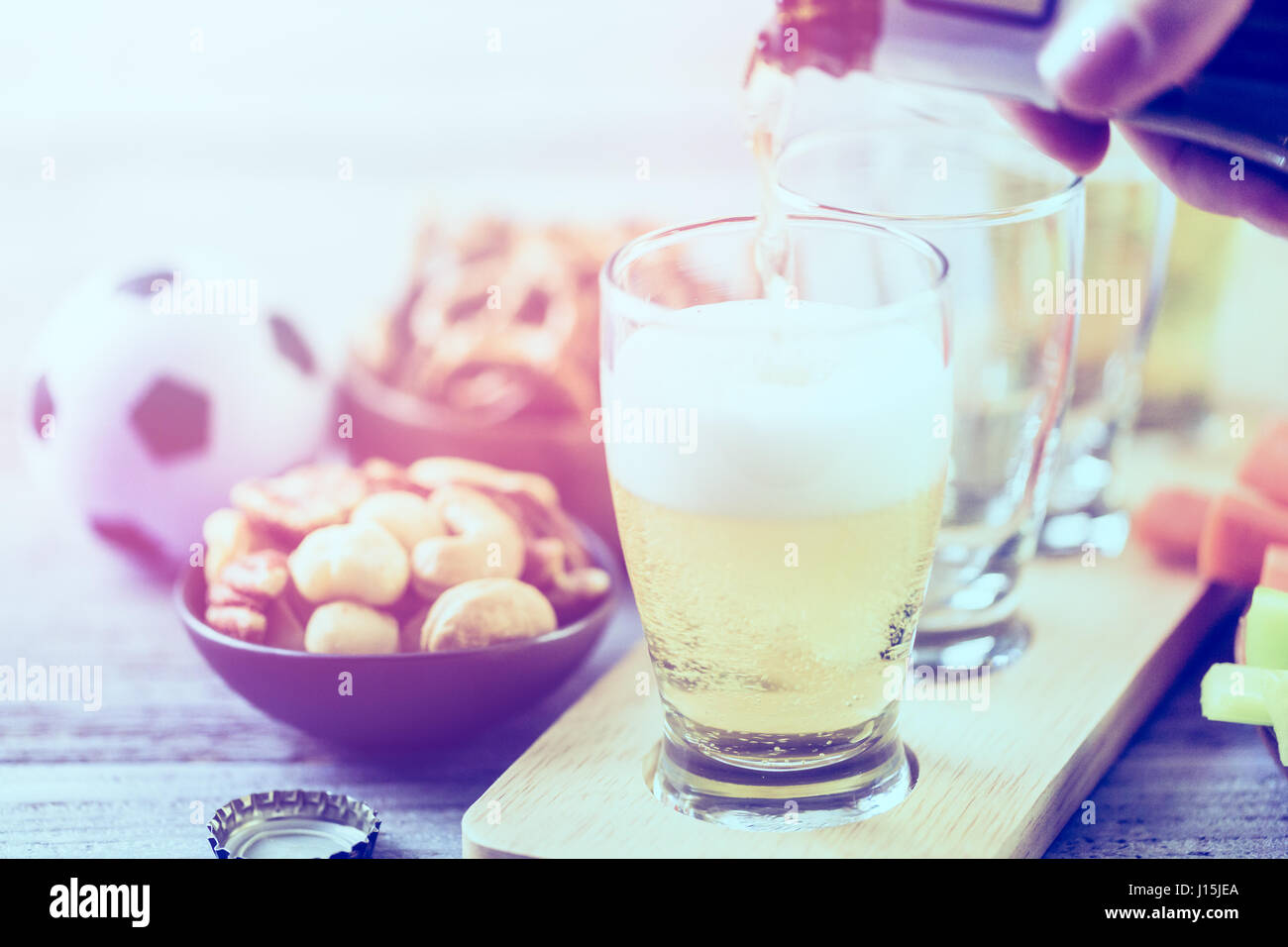 Step by step. Pouring draft beer into beer glass Stock Photo - Alamy
