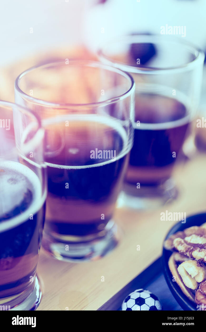 Draft beer and salty snacks on the table for soccer party Stock Photo ...