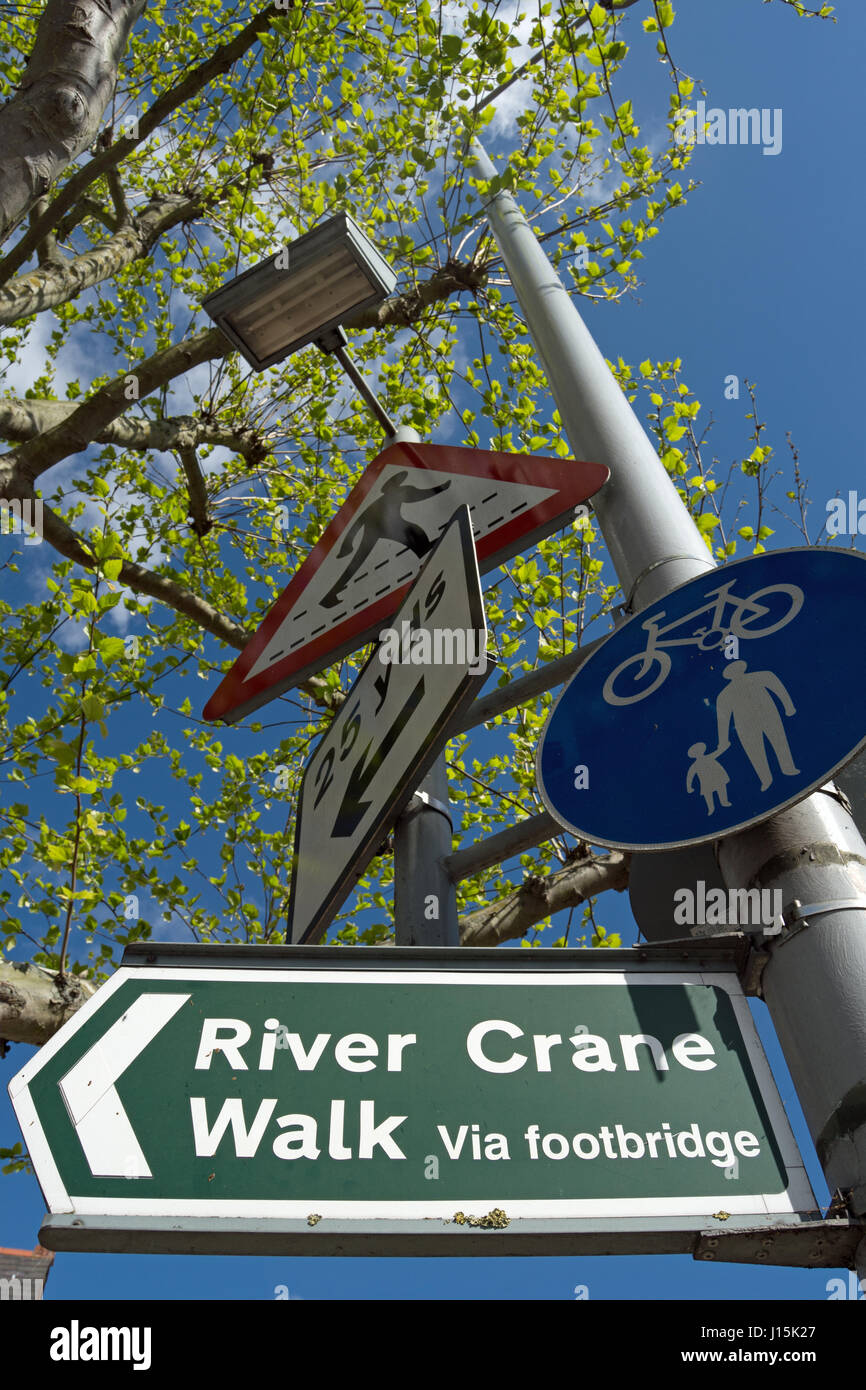 left pointing sign for the river crane walk, via footbridge, in ...