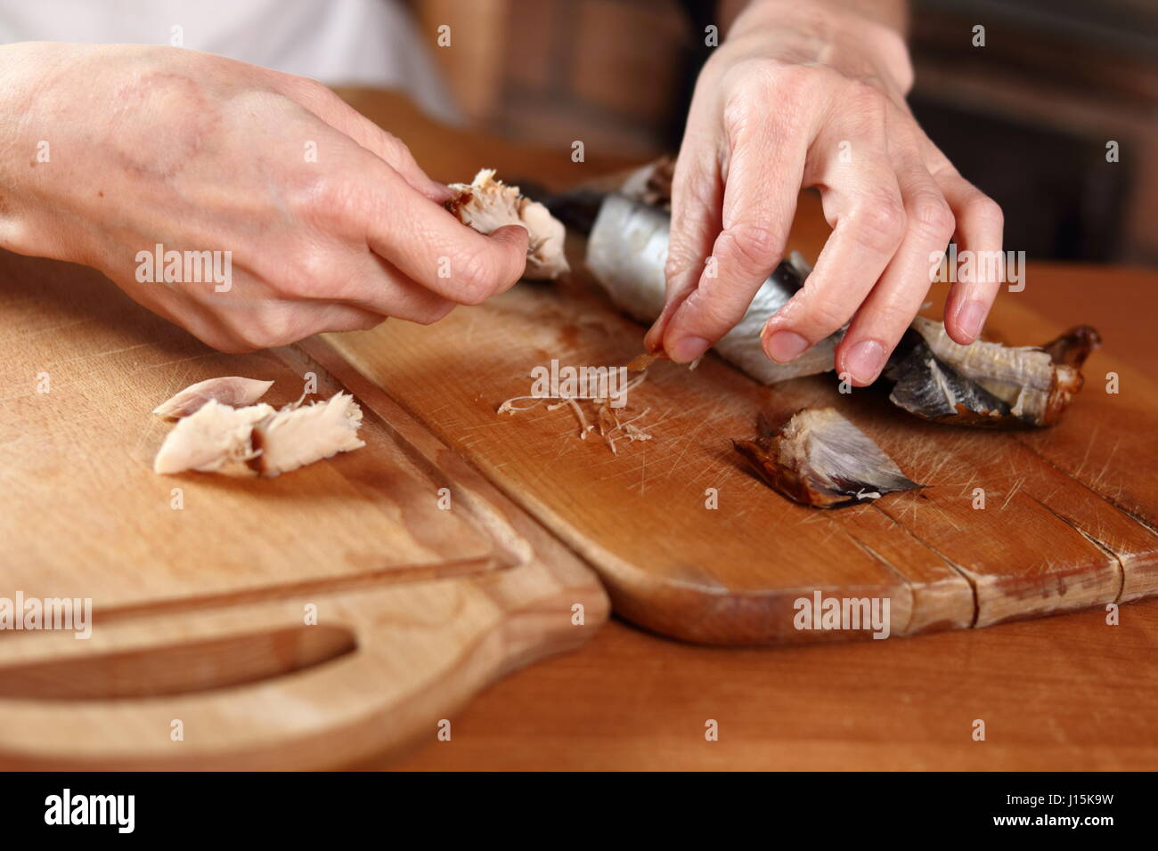 Woman removing fish hi-res stock photography and images - Alamy