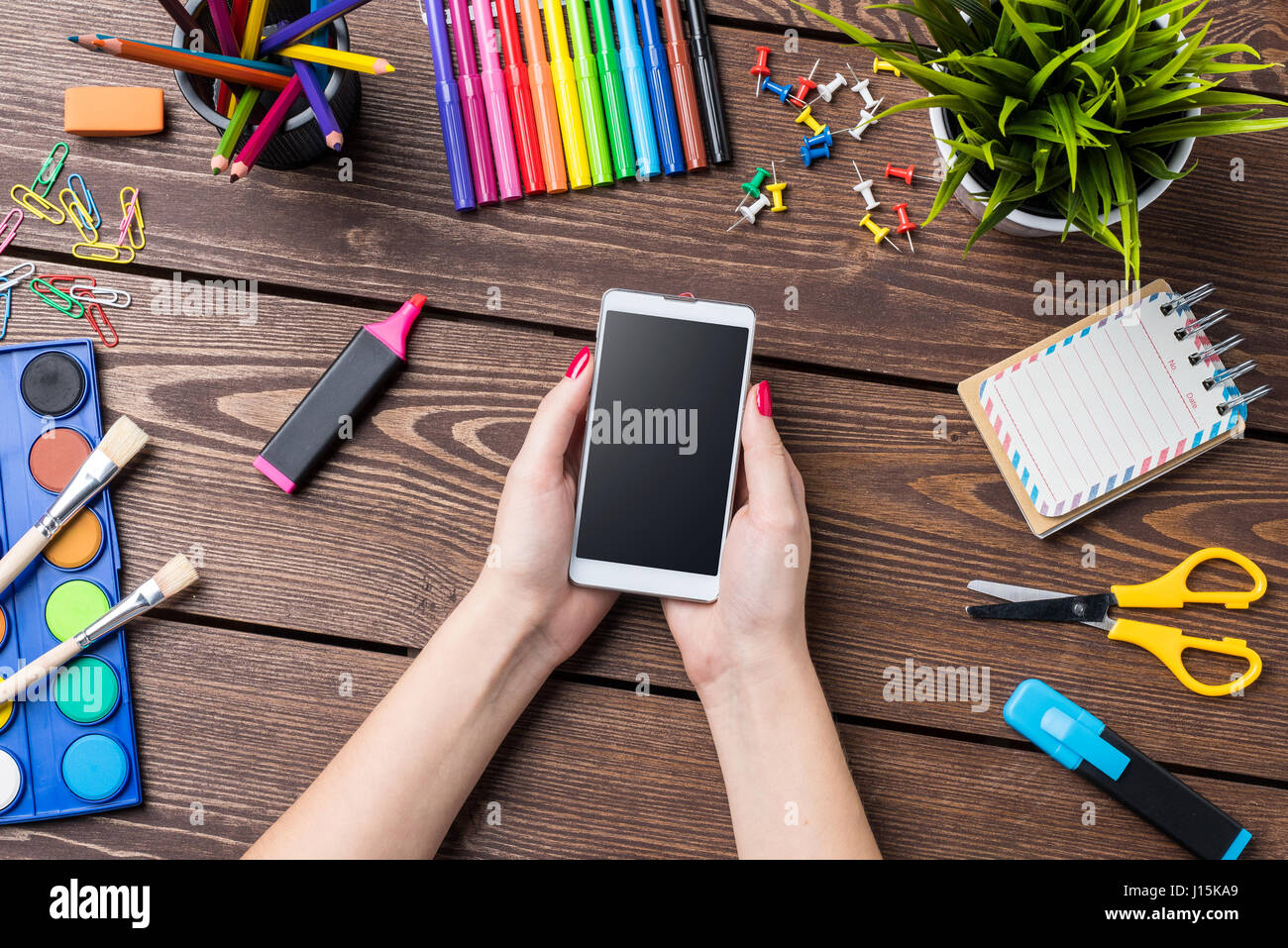 School kids using mobile phone hi-res stock photography and images - Alamy