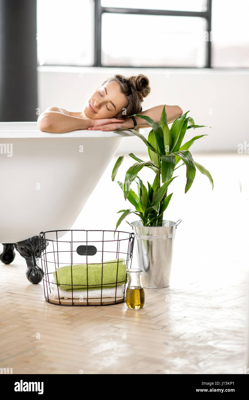 Woman relaxing in the bathtube Stock Photo - Alamy