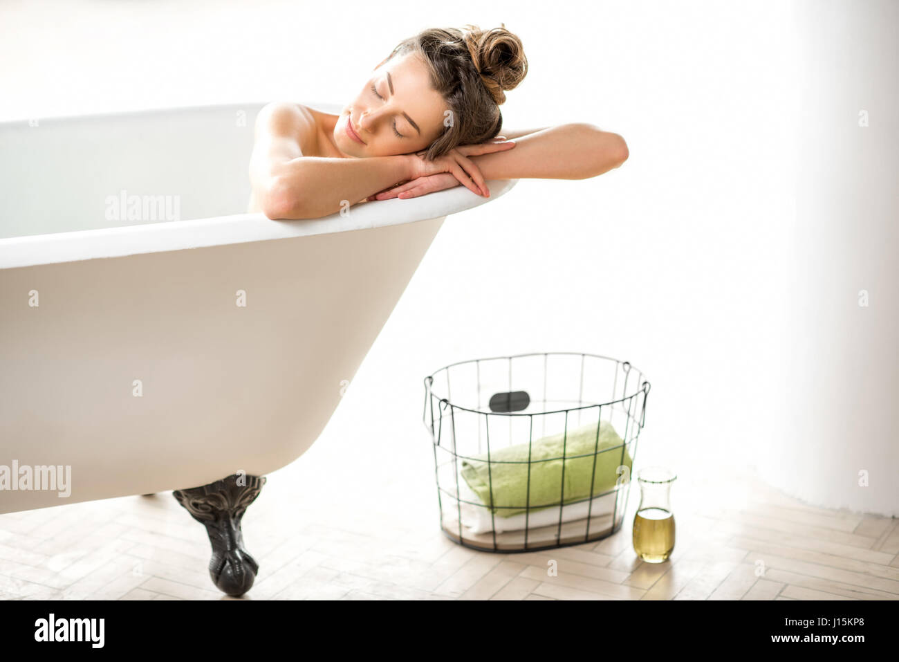 Woman relaxing in bath tub hi-res stock photography and images - Alamy