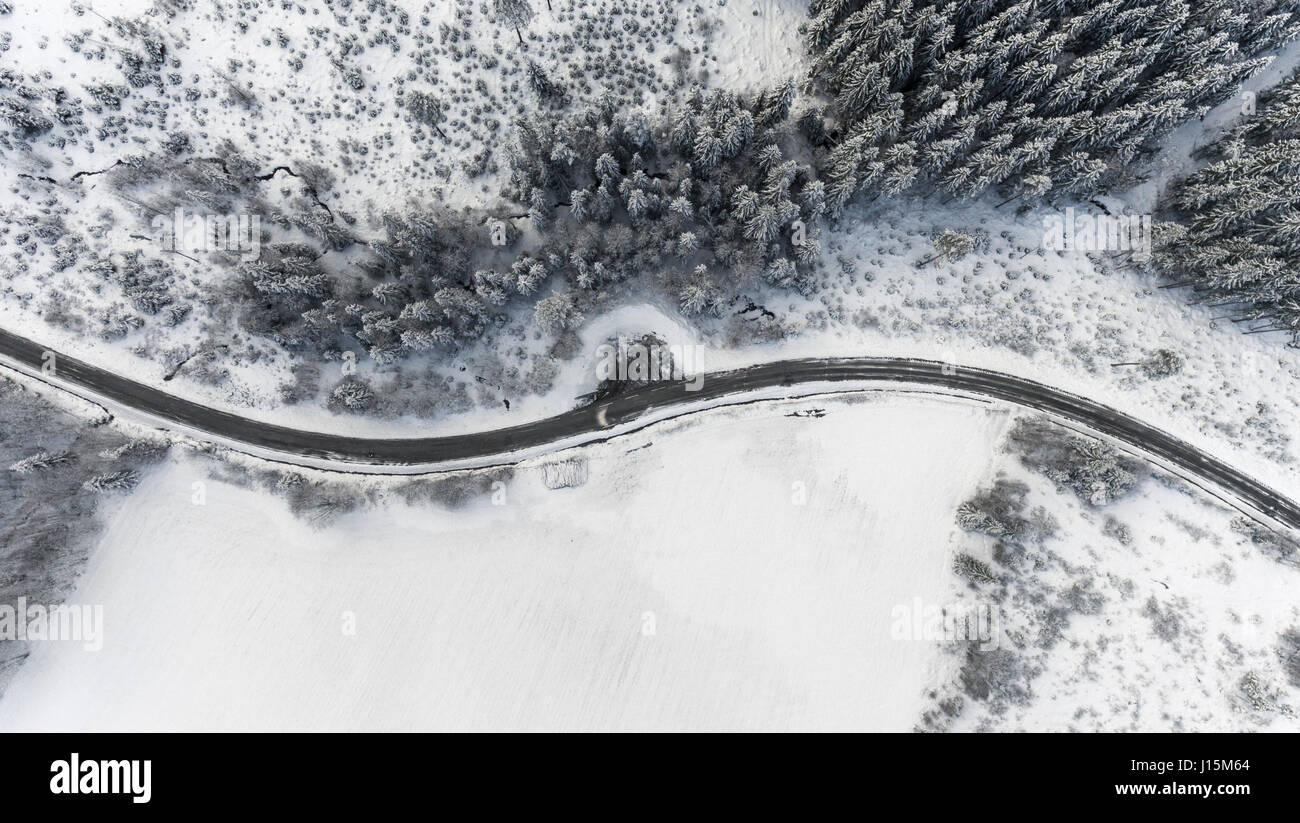 Winding road in snowy winter landscape from a bird's eye view Stock ...