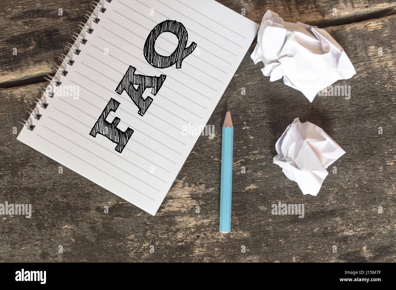 FAQ - Frequently Asked Questions text on a notebook with pen crumpled ...
