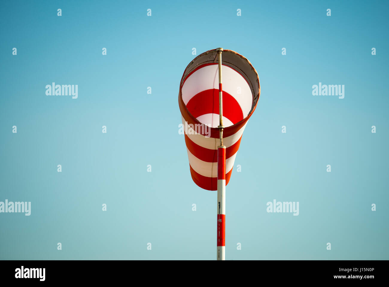 Horizontally flying windsock (wind vane) due to high wind Stock Photo ...