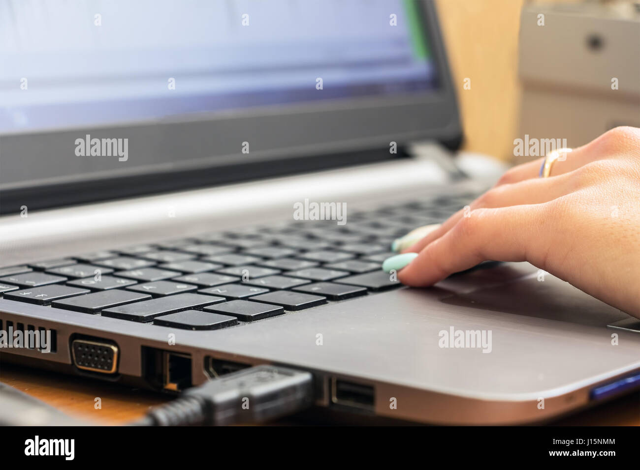 Woman's hand on keyboard Stock Photo - Alamy