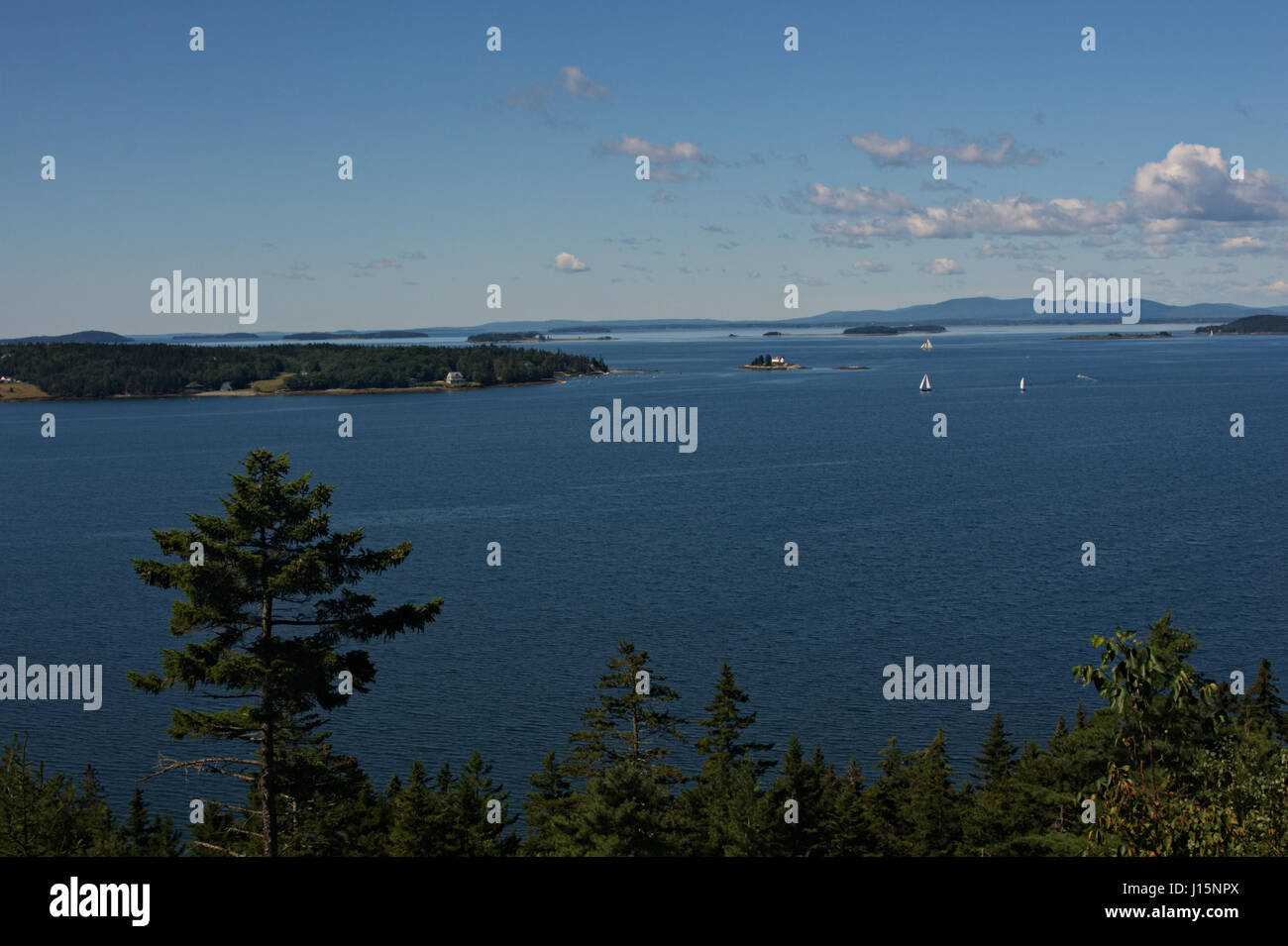 sailboats around the Pumpkin Island lighthouse just off Little Deer ...