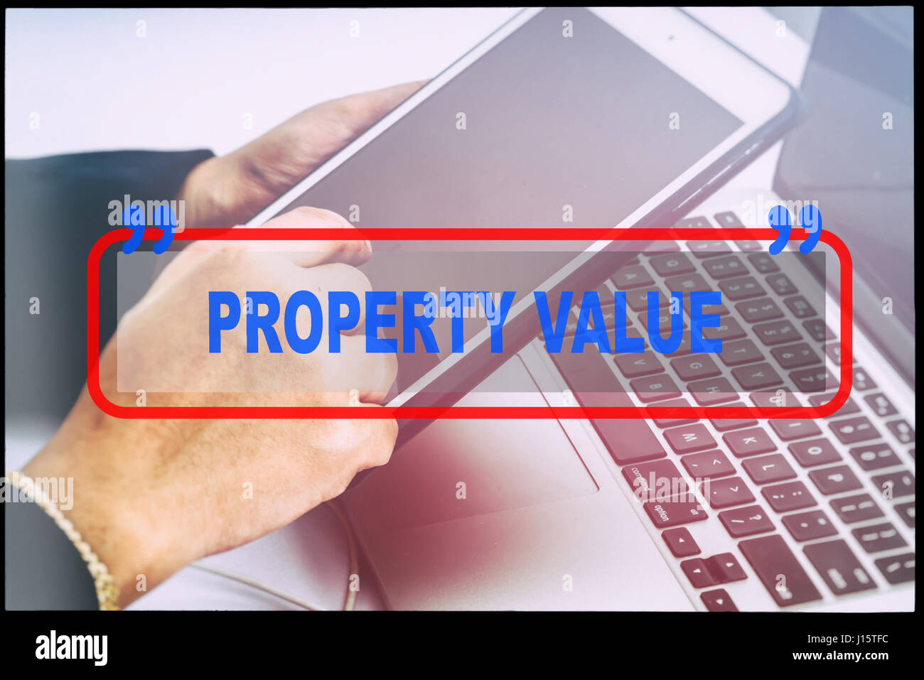 Hand and text "PROPERTY VALUE" with vintage background. Technology ...