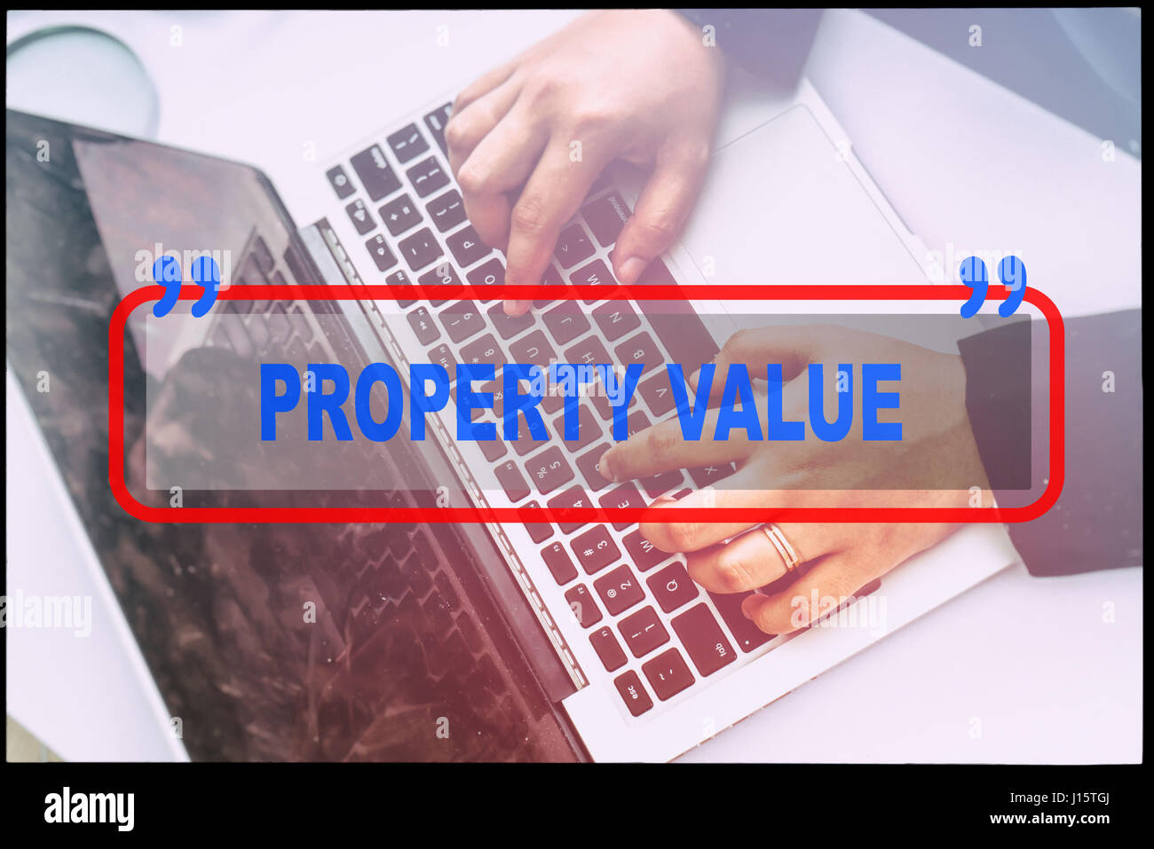 Hand and text "PROPERTY VALUE" with vintage background. Technology ...