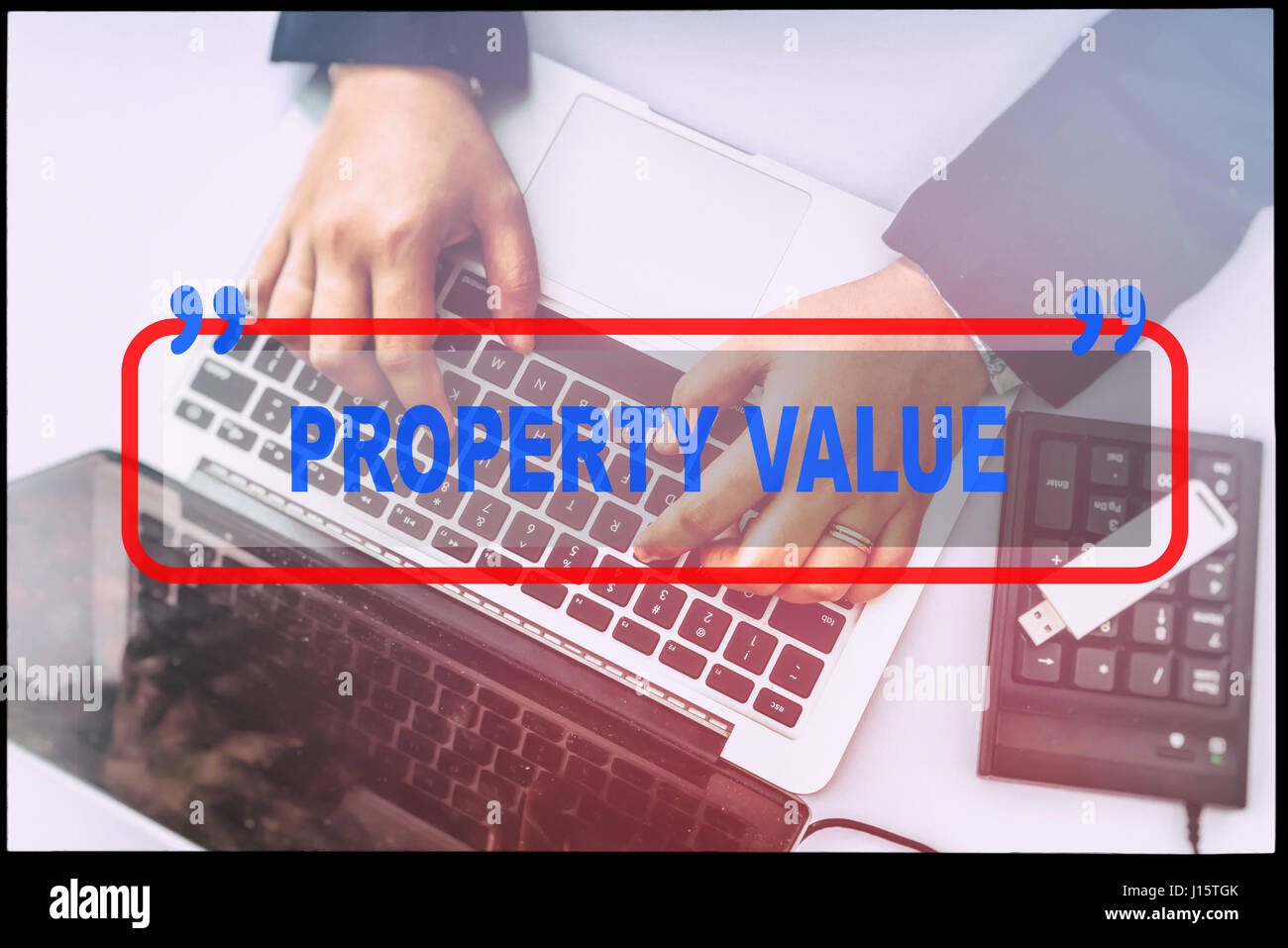 Hand and text "PROPERTY VALUE" with vintage background. Technology ...