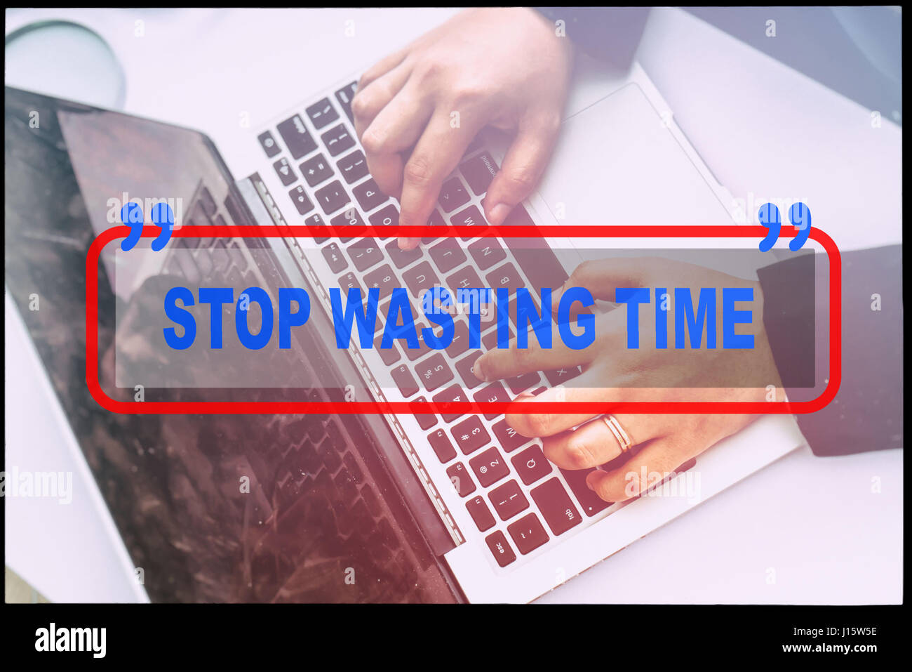 Hand and text "STOP WASTING TIME" with vintage background. Technology ...