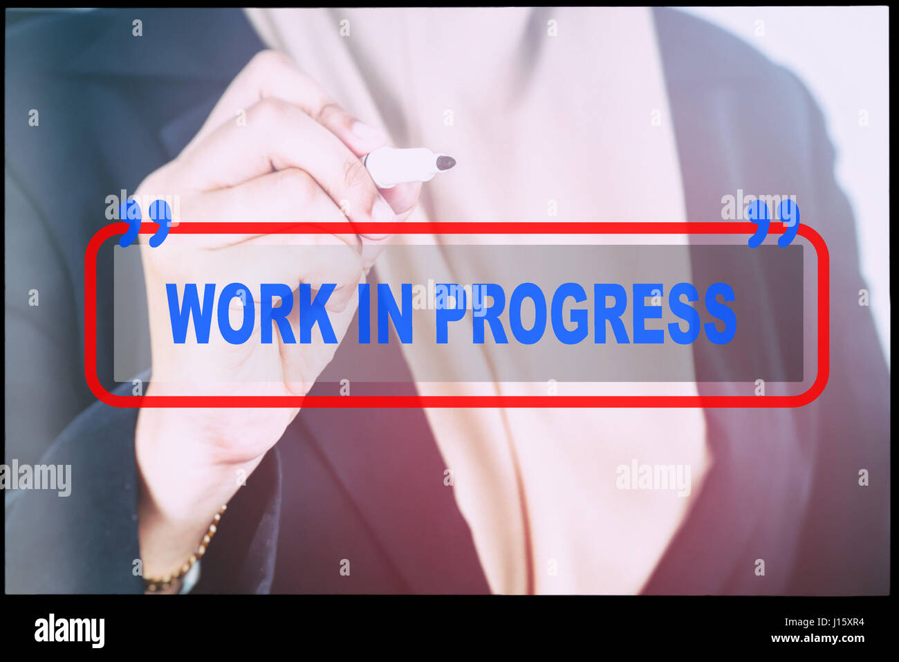 Hand and text "WORK IN PROGRESS" with vintage background. Technology ...