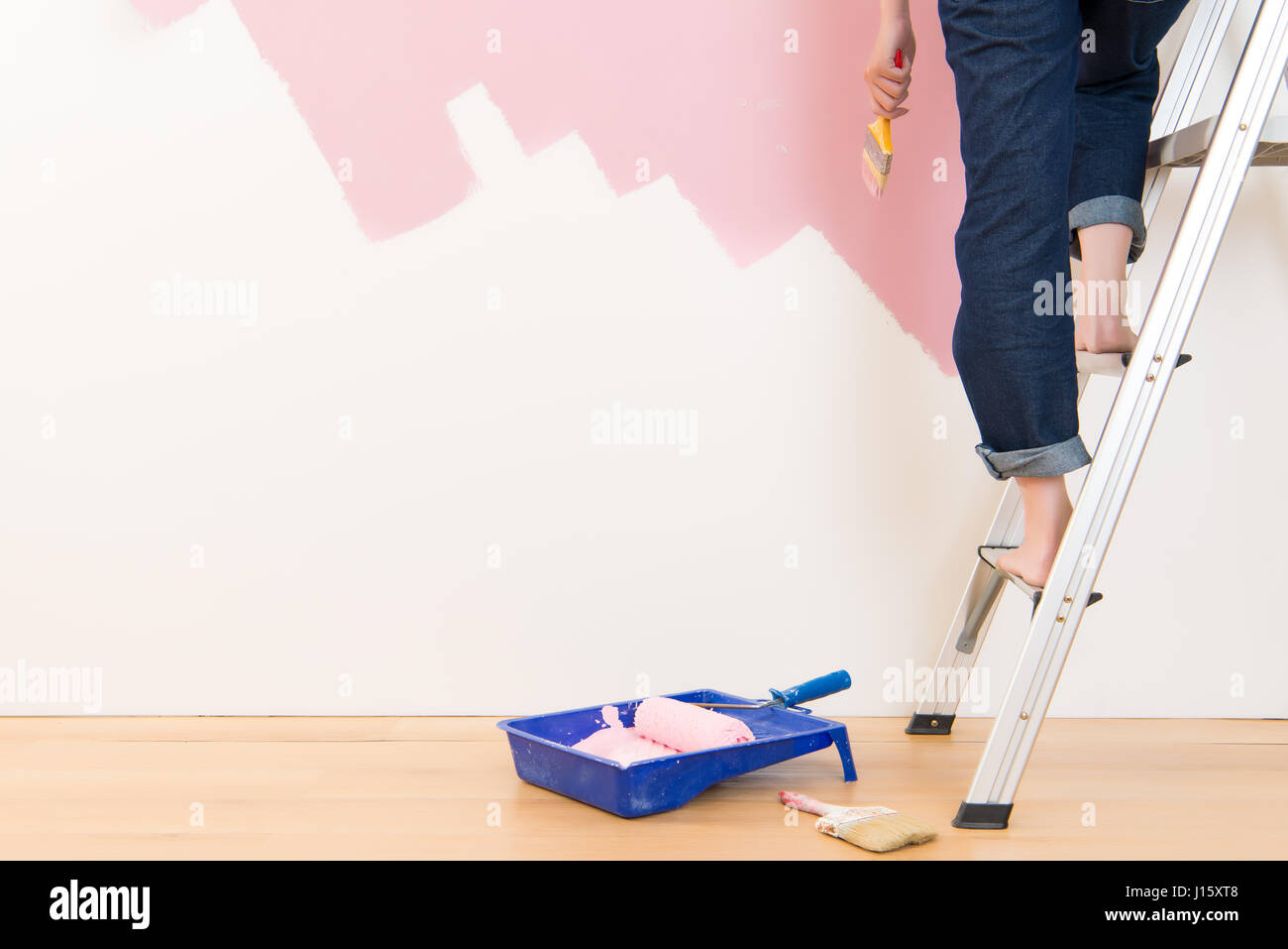 Woman standing on step ladder hi-res stock photography and images - Alamy