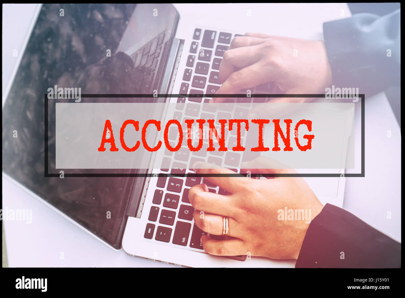 Hand and text ACCOUNTING with vintage backgound. Technology concept ...