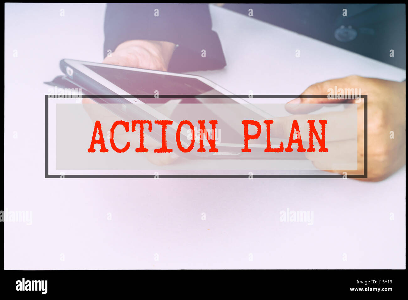Hand and text ACTION PLAN with vintage backgound. Technology concept ...