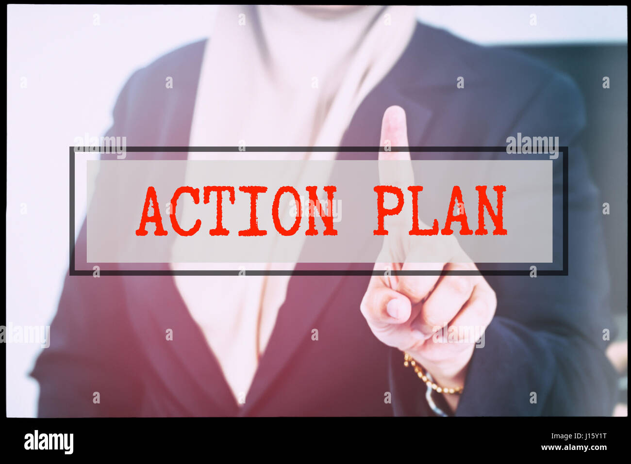 Hand and text ACTION PLAN with vintage backgound. Technology concept ...