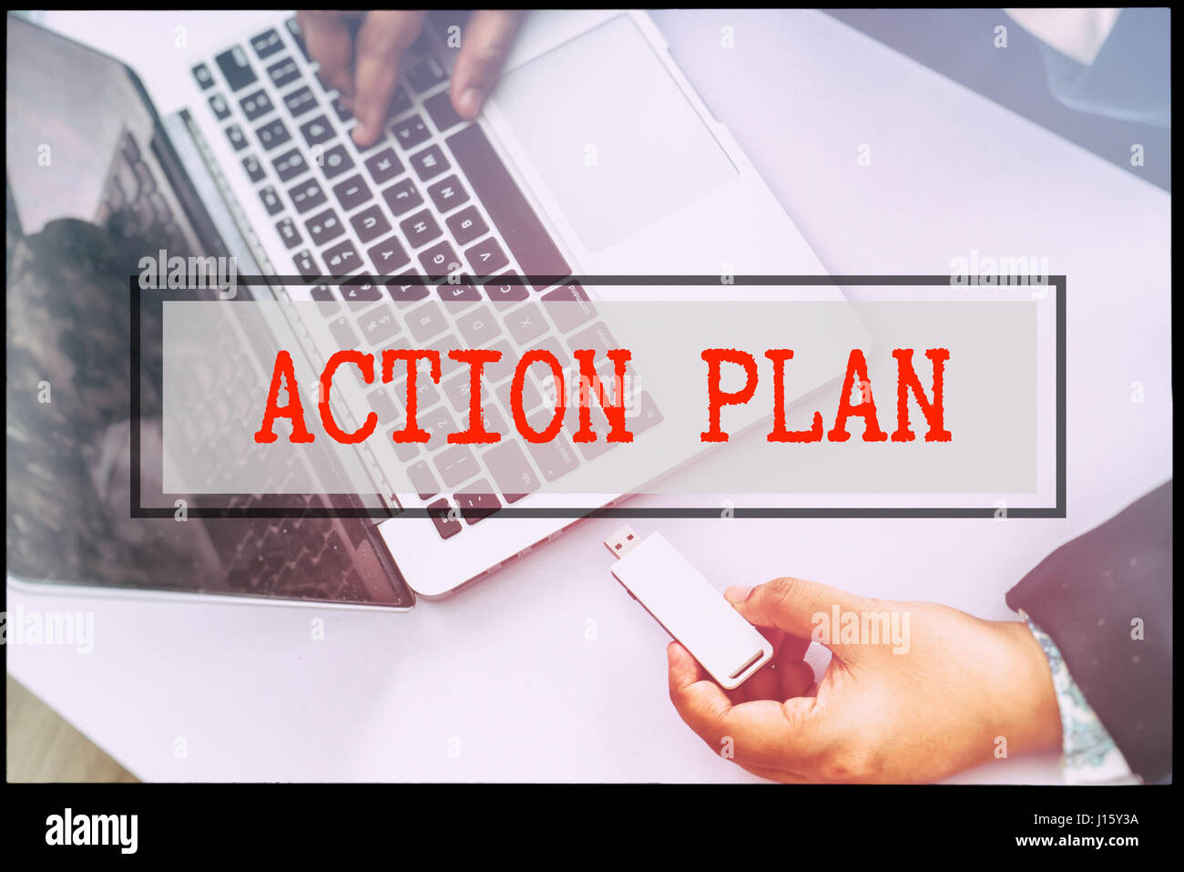 Hand and text ACTION PLAN with vintage backgound. Technology concept ...