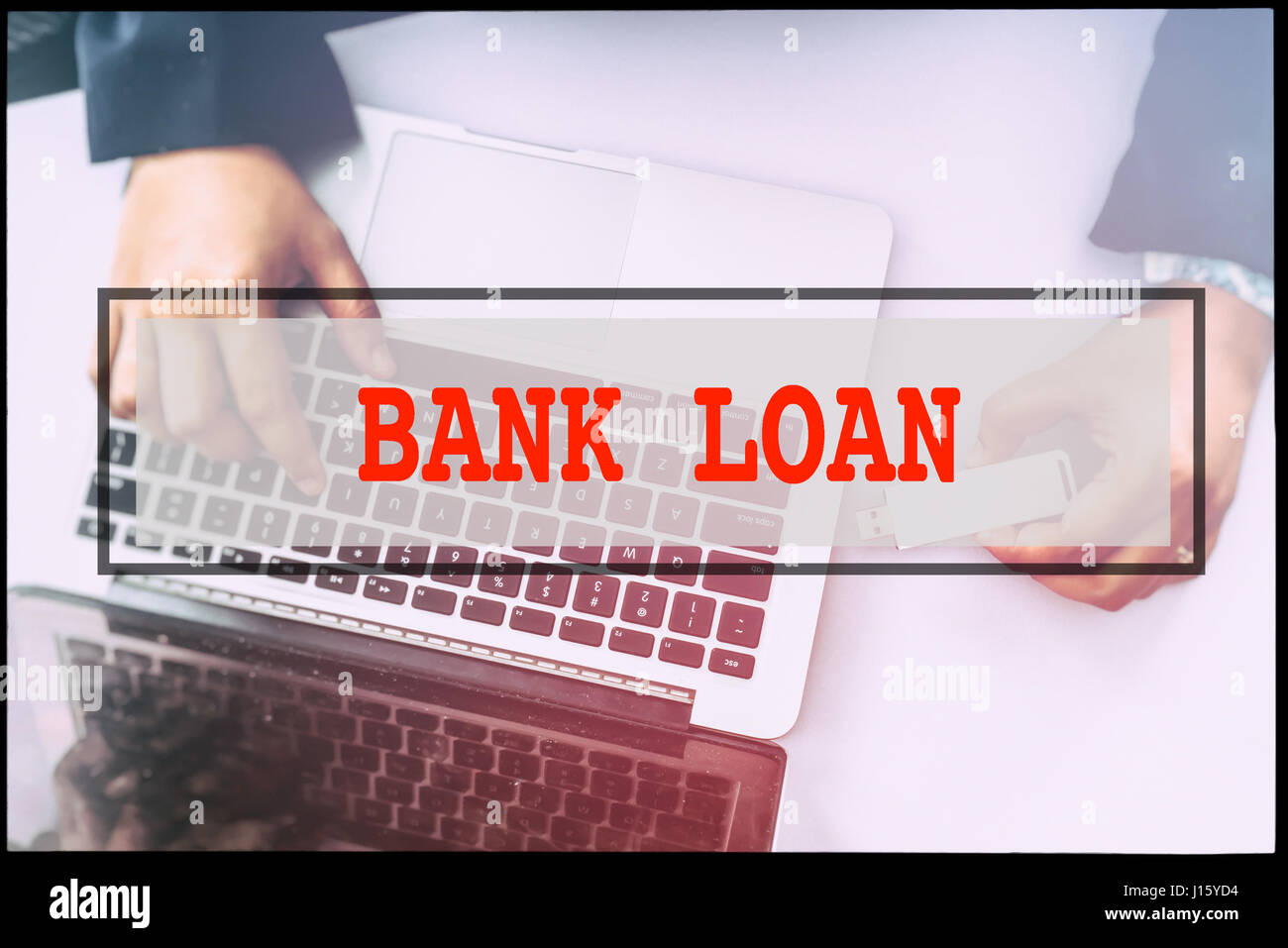 Hand and text BANK LOAN with vintage background. Technology concept ...