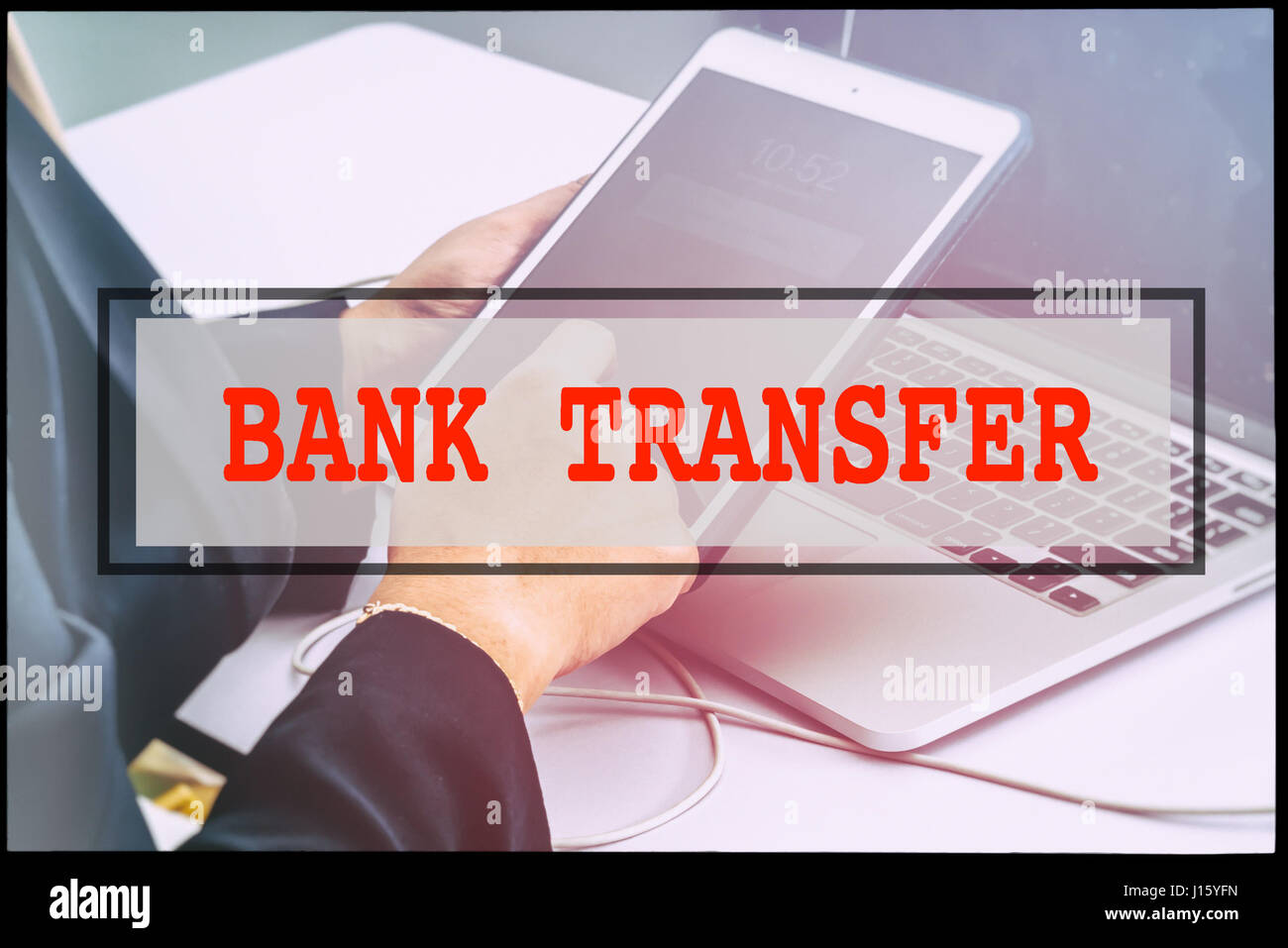 Hand and text BANK TRANSFER with vintage background. Technology concept ...