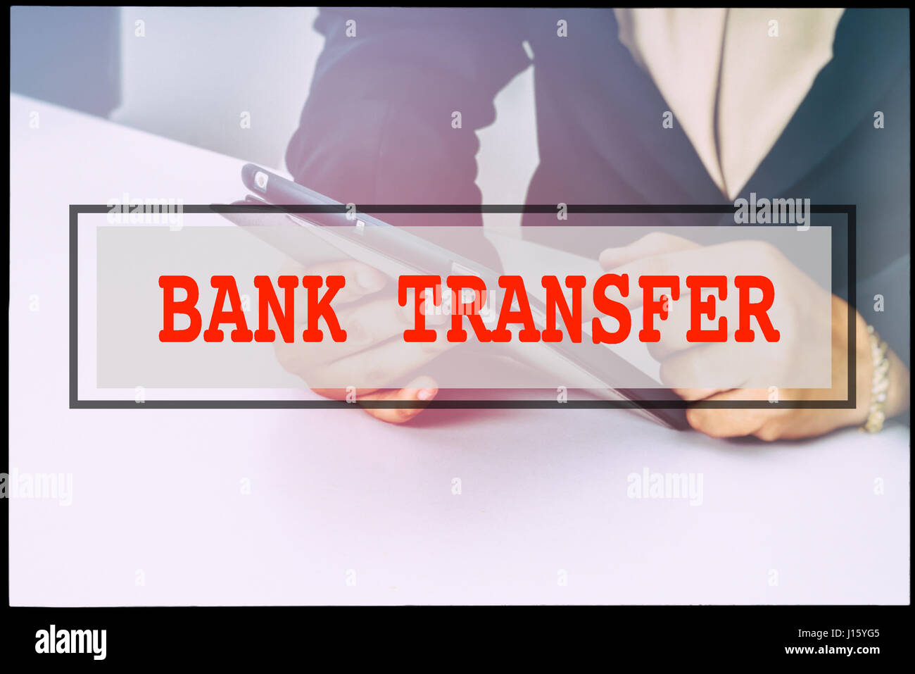 Hand and text BANK TRANSFER with vintage background. Technology concept ...