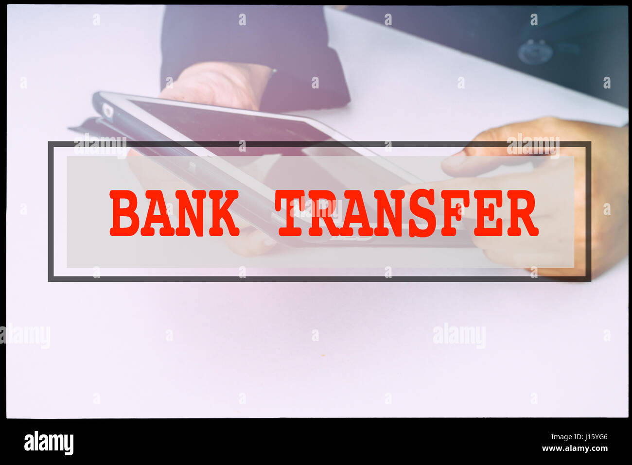 Hand and text BANK TRANSFER with vintage background. Technology concept ...
