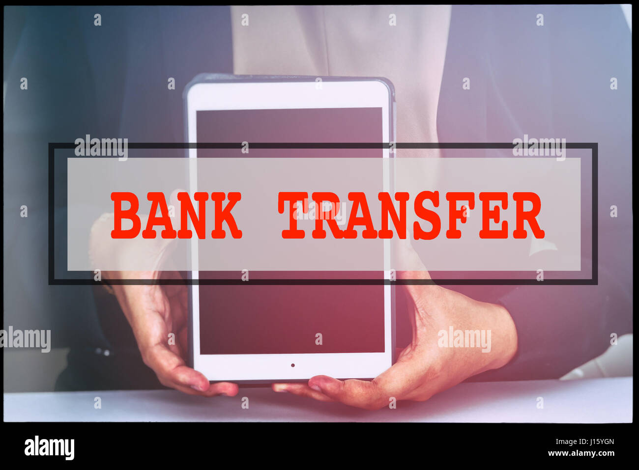 Hand and text BANK TRANSFER with vintage background. Technology concept ...