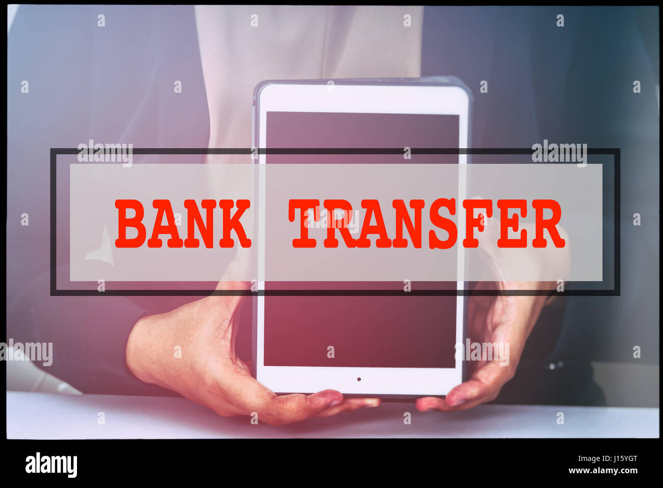 Hand and text BANK TRANSFER with vintage background. Technology concept ...