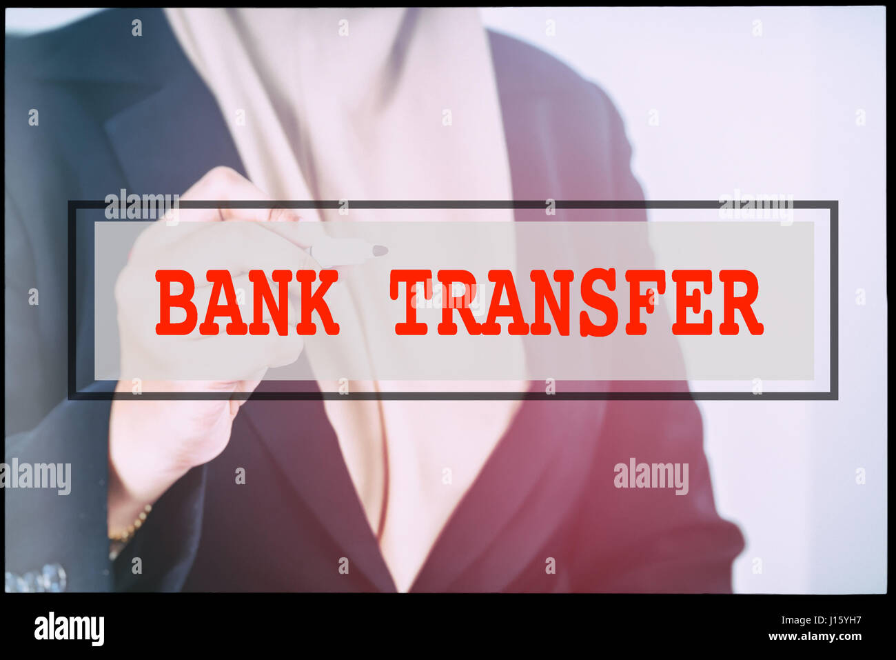 Hand and text BANK TRANSFER with vintage background. Technology concept ...
