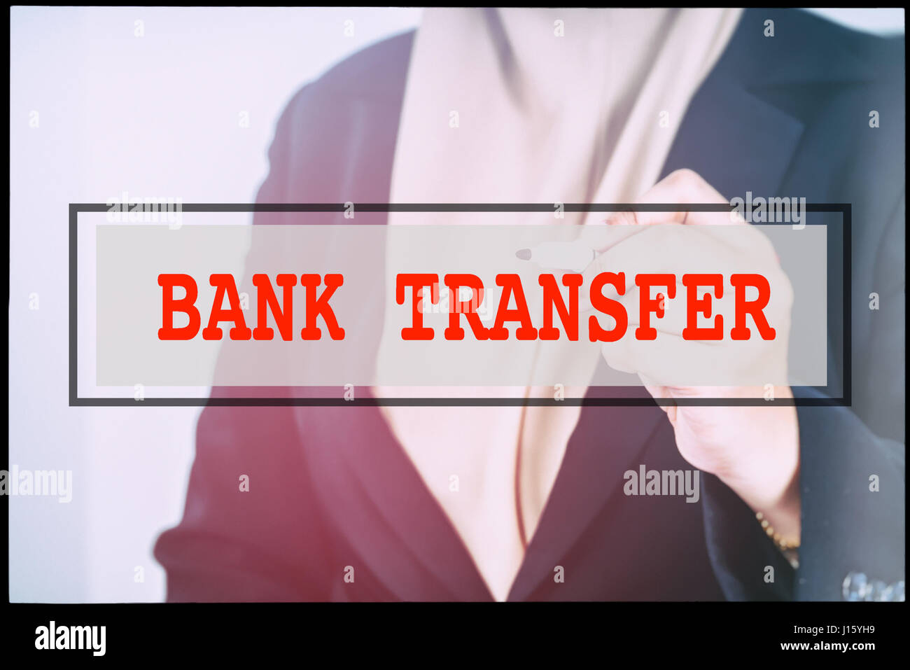 Hand and text BANK TRANSFER with vintage background. Technology concept ...
