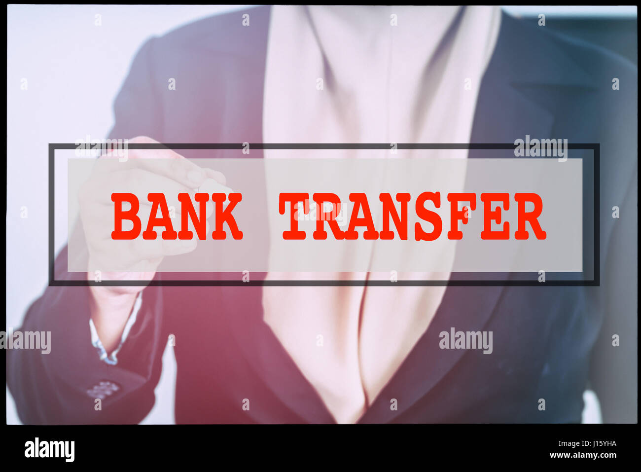 Hand and text BANK TRANSFER with vintage background. Technology concept ...