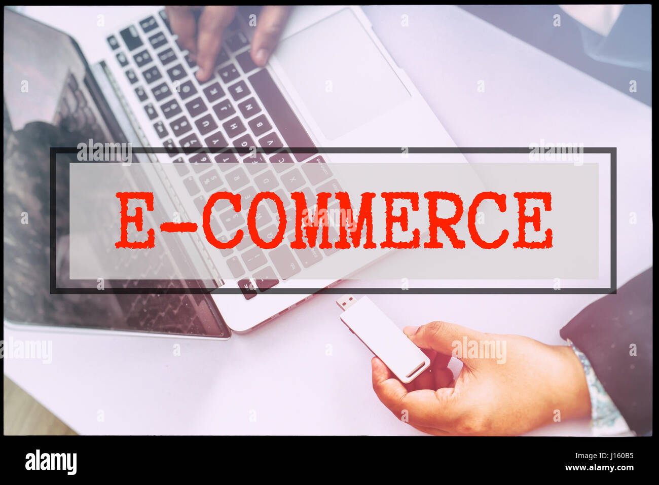 Hand and text E- COMMERCE with vintage backgound. Technology concept ...