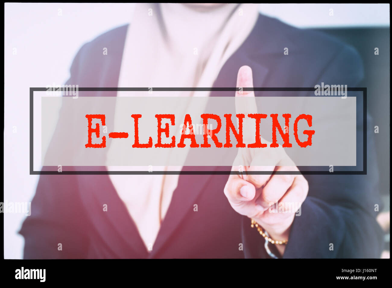 Hand and text E- LEARNING with vintage backgound. Technology concept ...