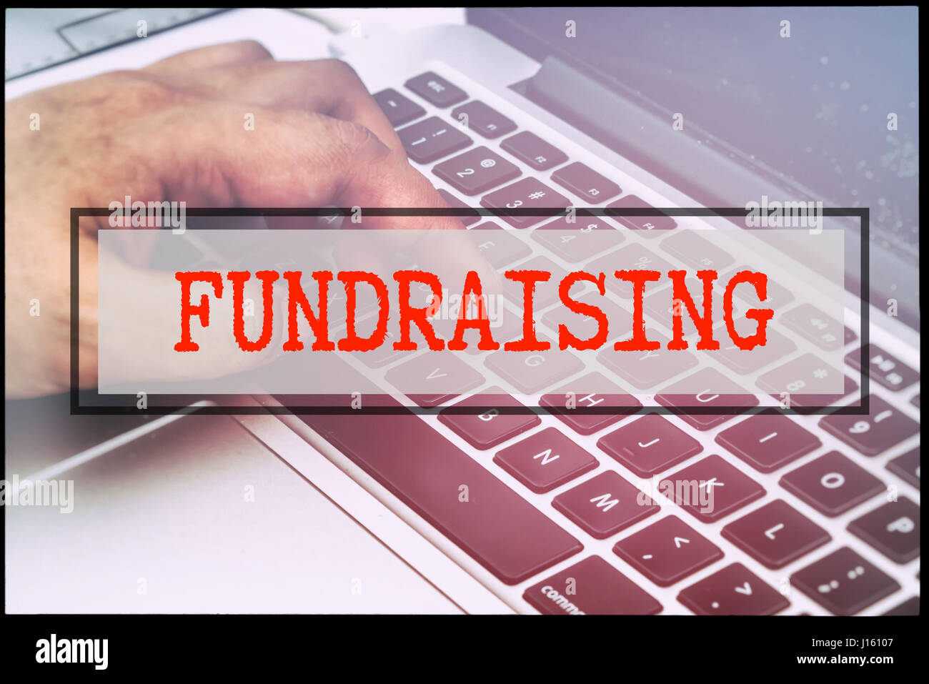 Hand and text FUNDRAISING with vintage backgound. Technology concept ...