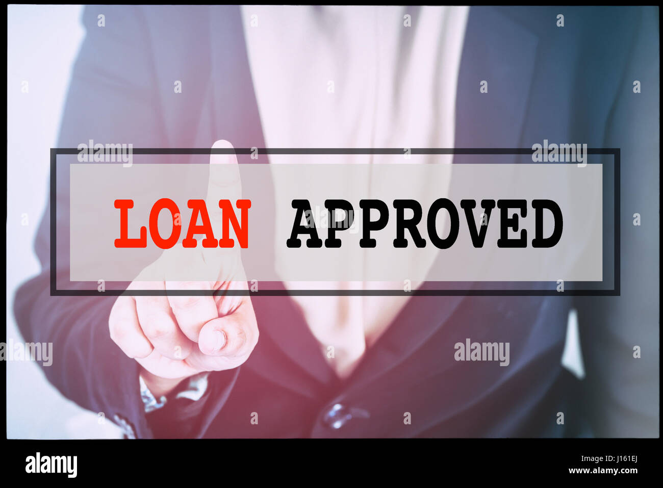 Hand and text LOAN APPROVED with vintage background. Technology concept ...
