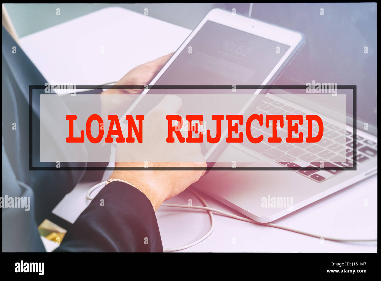 Hand and text LOAN REJECTED with vintage background. Technology concept ...