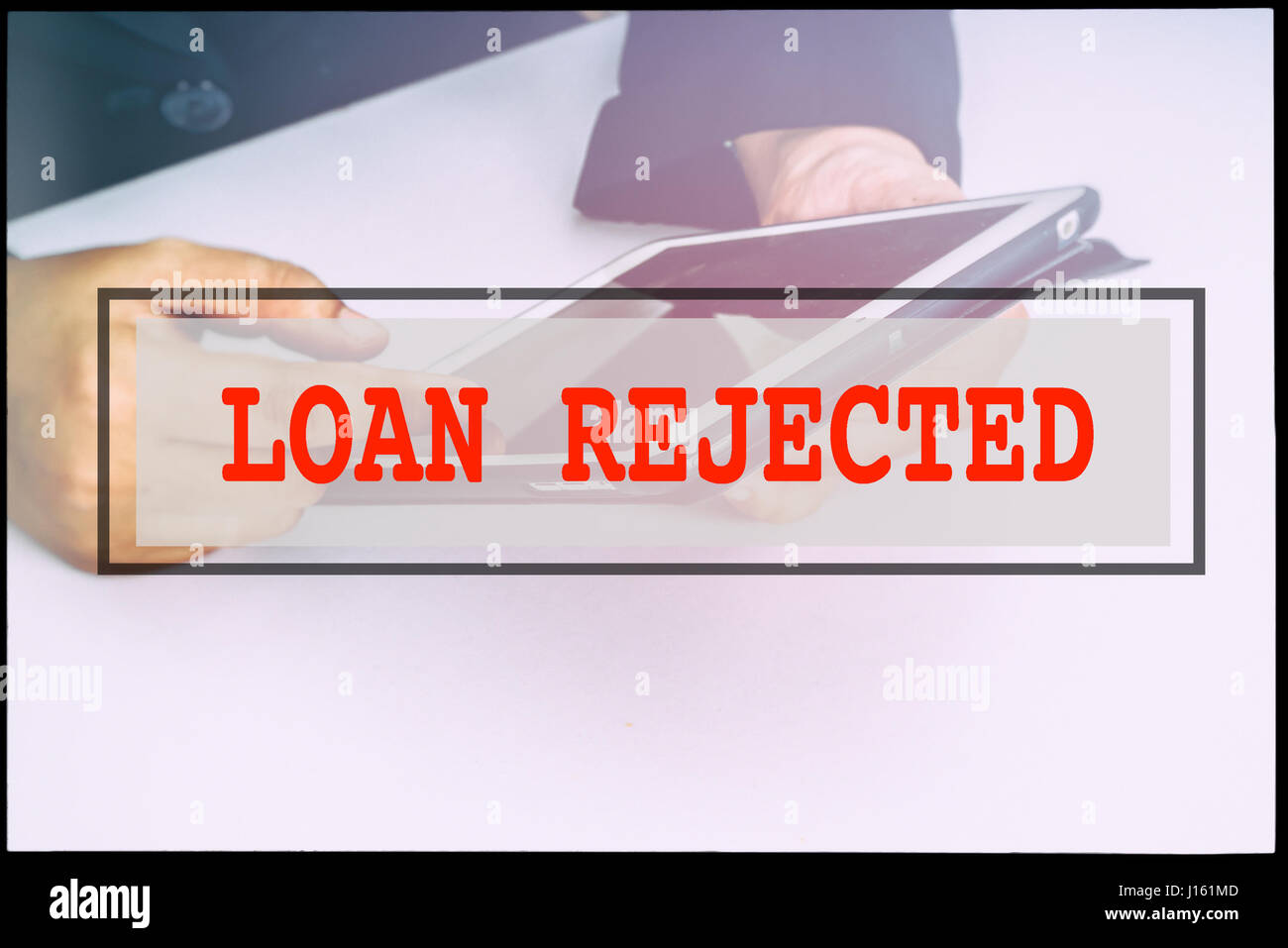 Hand and text LOAN REJECTED with vintage background. Technology concept ...