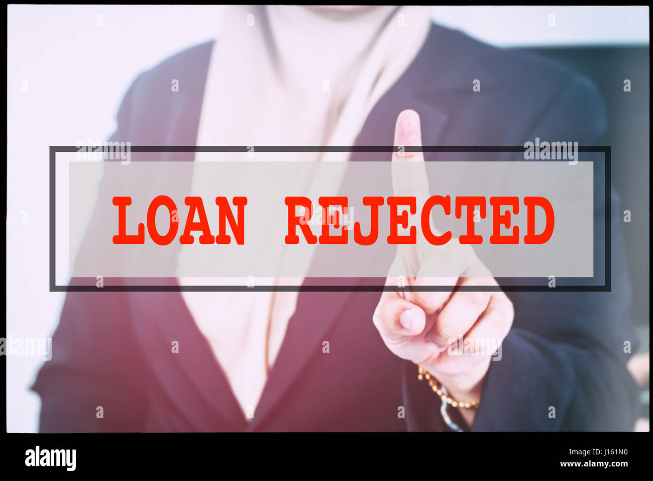 Hand and text LOAN REJECTED with vintage background. Technology concept ...