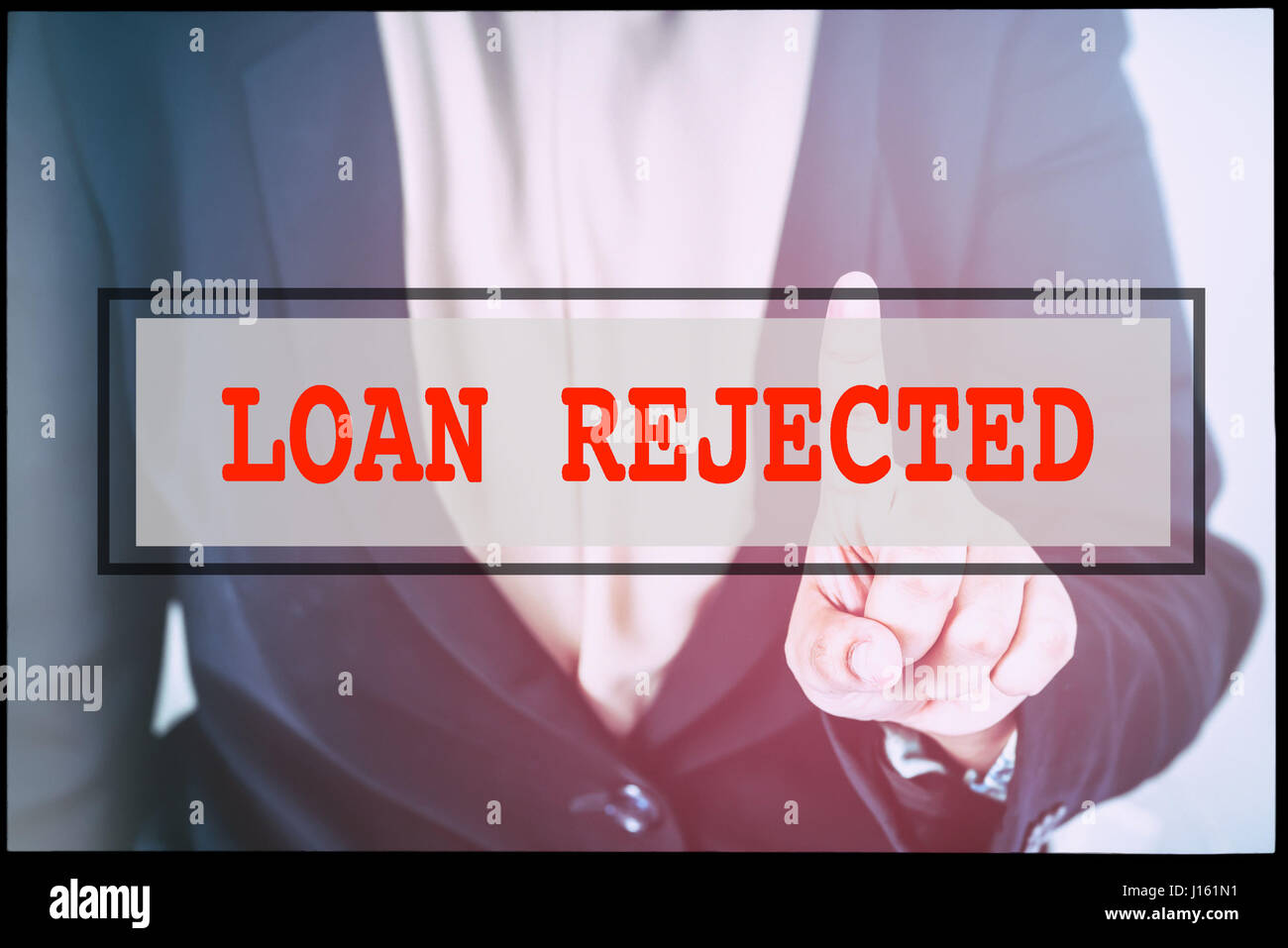 Hand and text LOAN REJECTED with vintage background. Technology concept ...