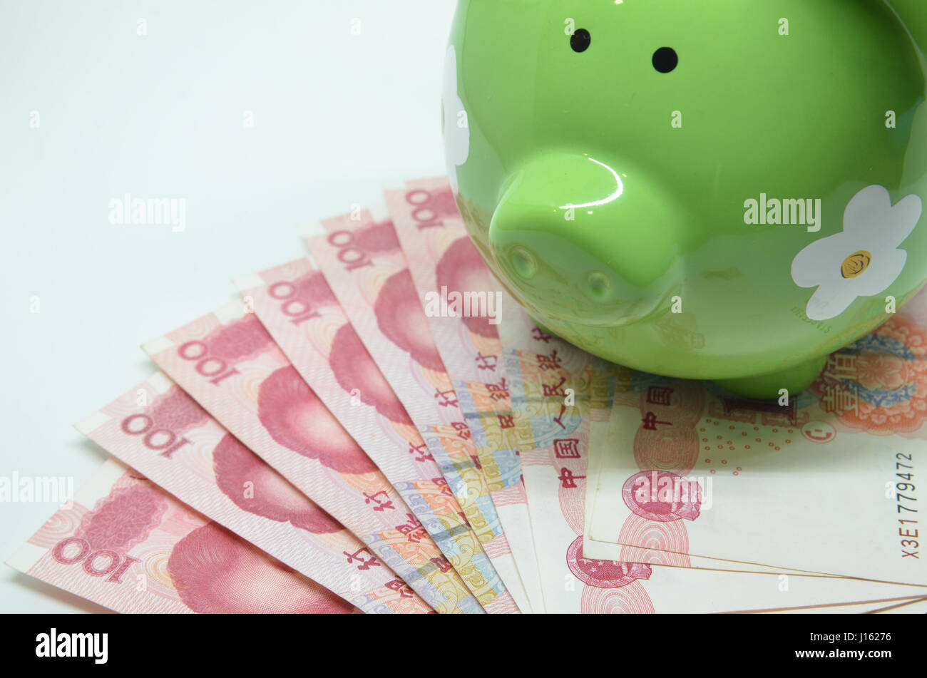 Green piggy bank with China currency RMB Stock Photo - Alamy